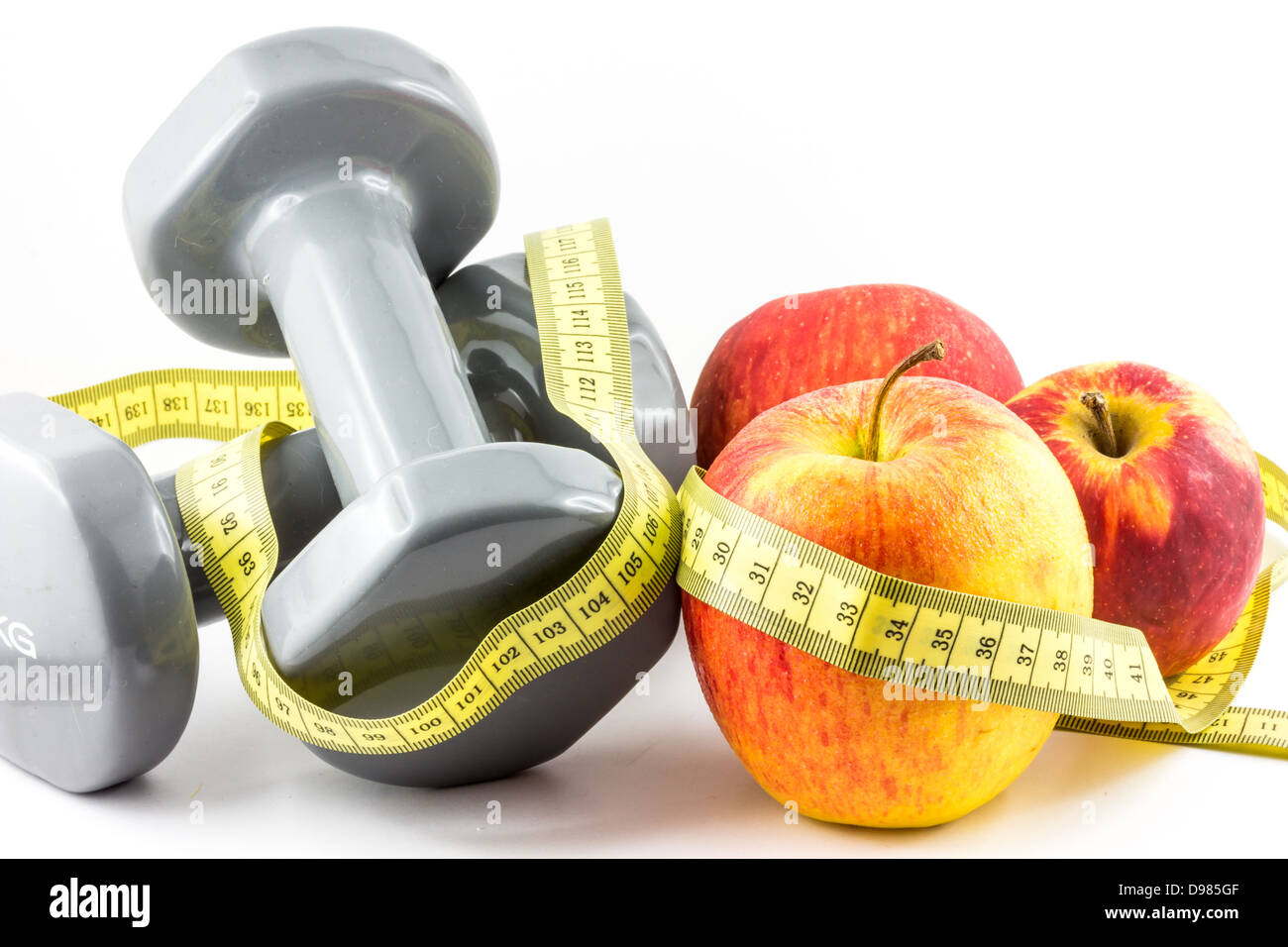 Apple, dumbbell and tape - fitness and health nutrition concept Stock ...