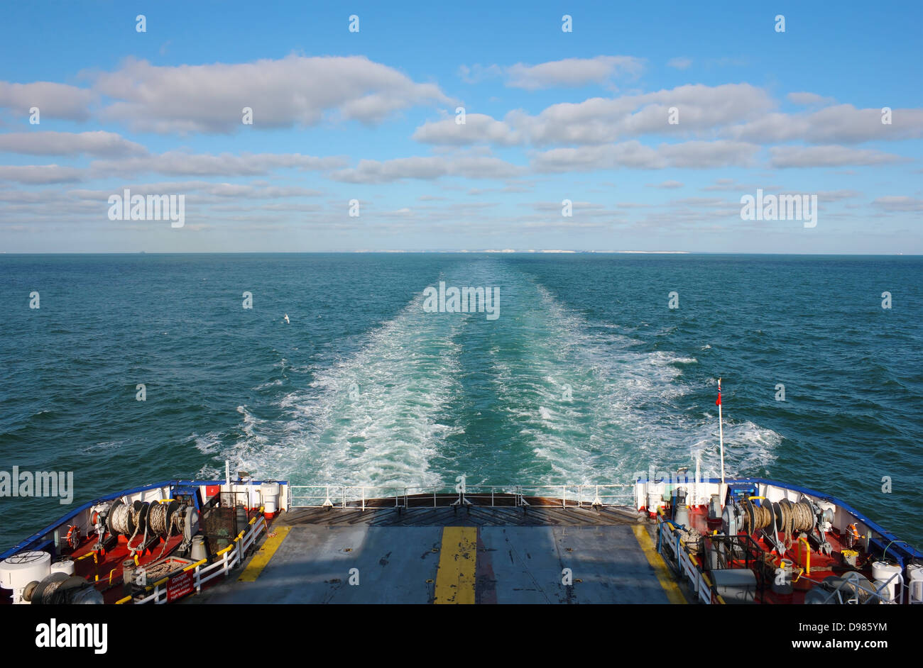 Ferry Boat traveling at full speed toward Calais in a clear bright day ...