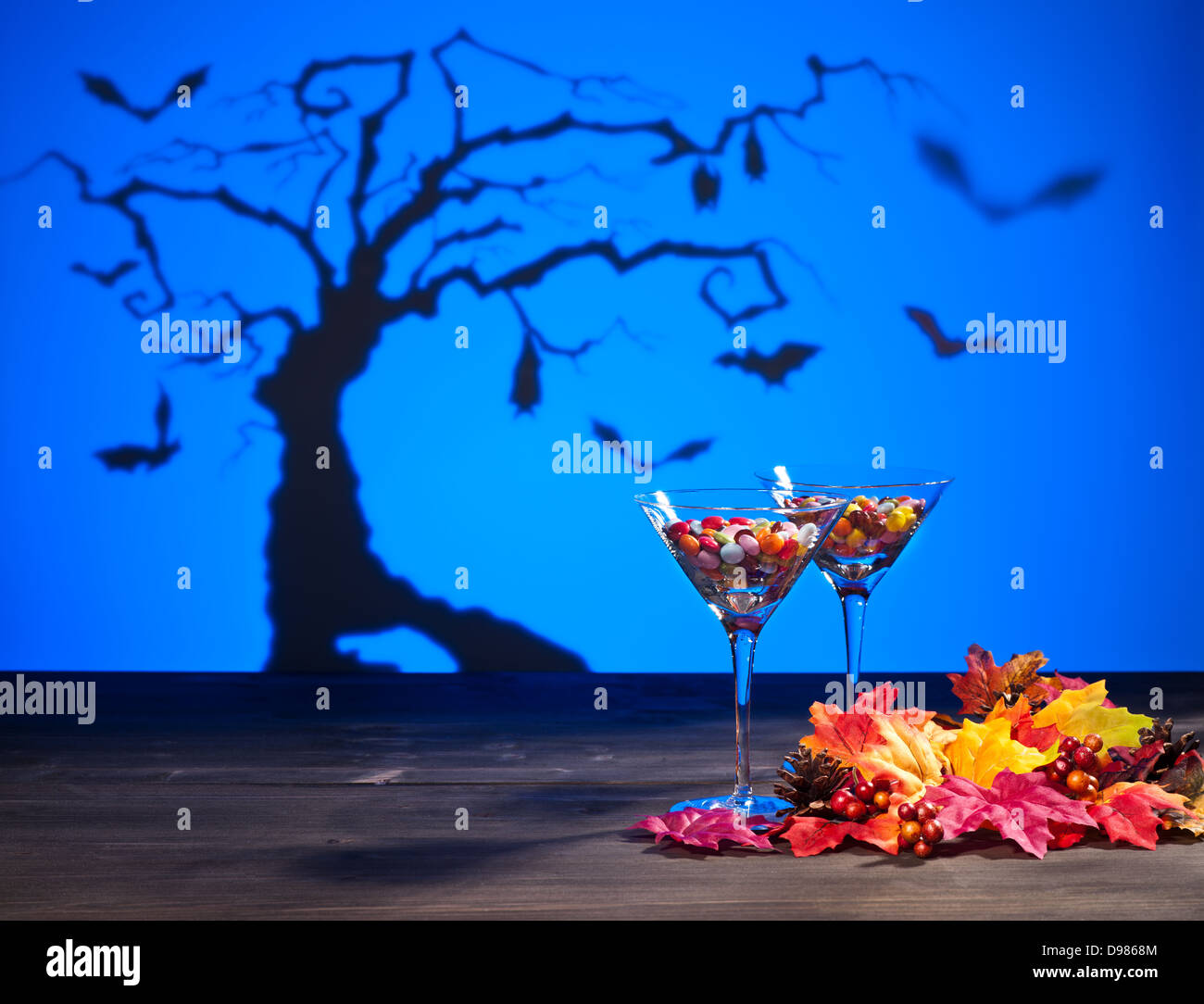 Halloween landscape a tree and a Martini glass with sweets Stock Photo ...