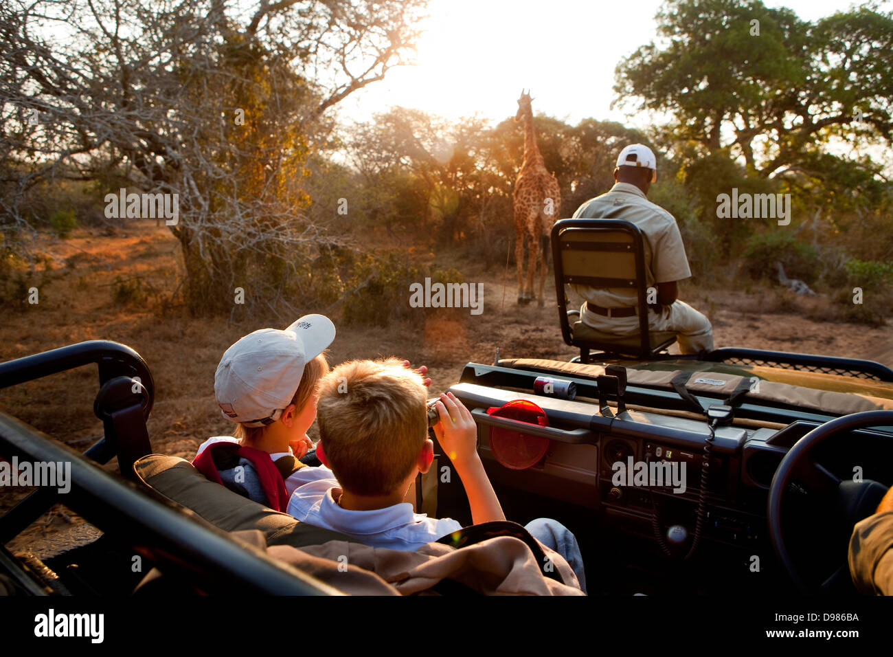 Robin Tetlow Shooter with Tyler Talmage viewing a giraffe from a safari ...