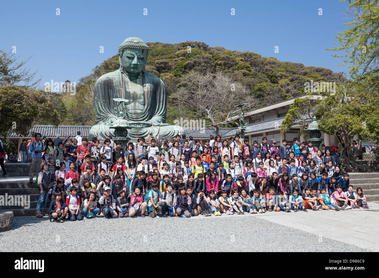 Japanese schoolers are photographed against the backdrop of the Great ...