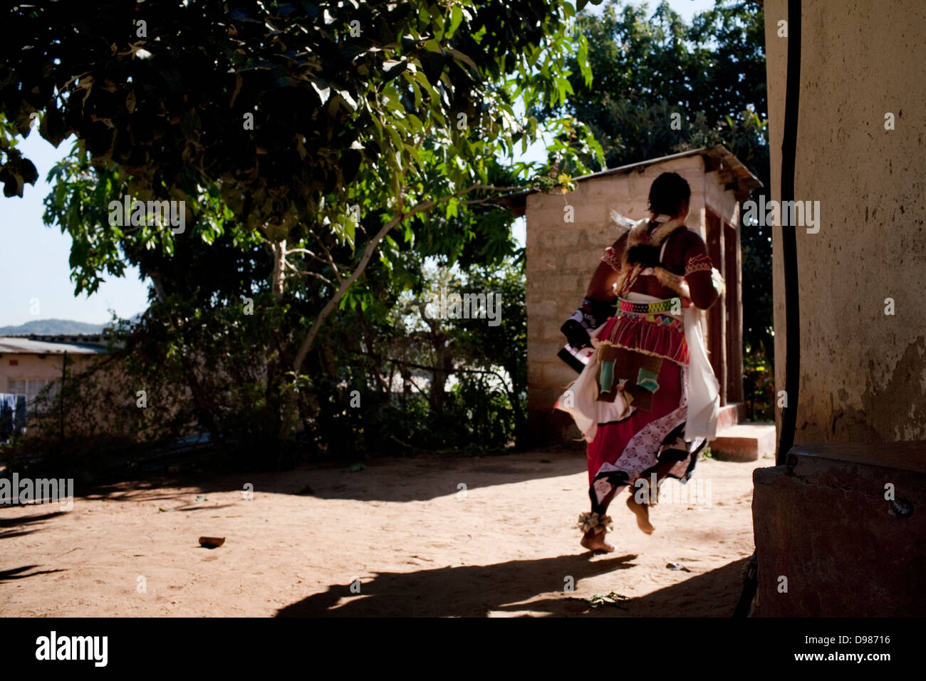 Ribbon 30 runs around huts during sangoma initiation ceremony in ...