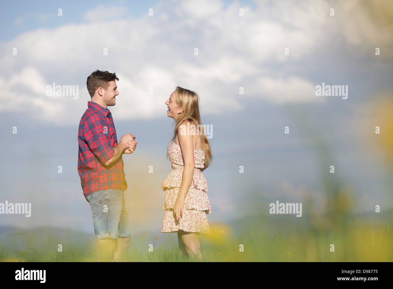 a young couple in a beautiful landscape Stock Photo - Alamy