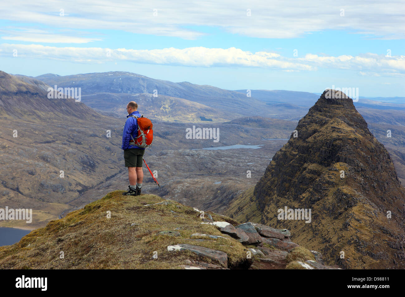 Man looking at the view from Caisteal Liath the highest point on ...