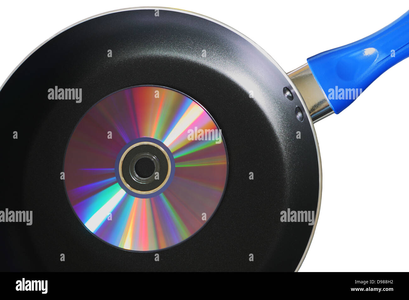 Compact disk on a frying pan isolated on white background Stock Photo ...