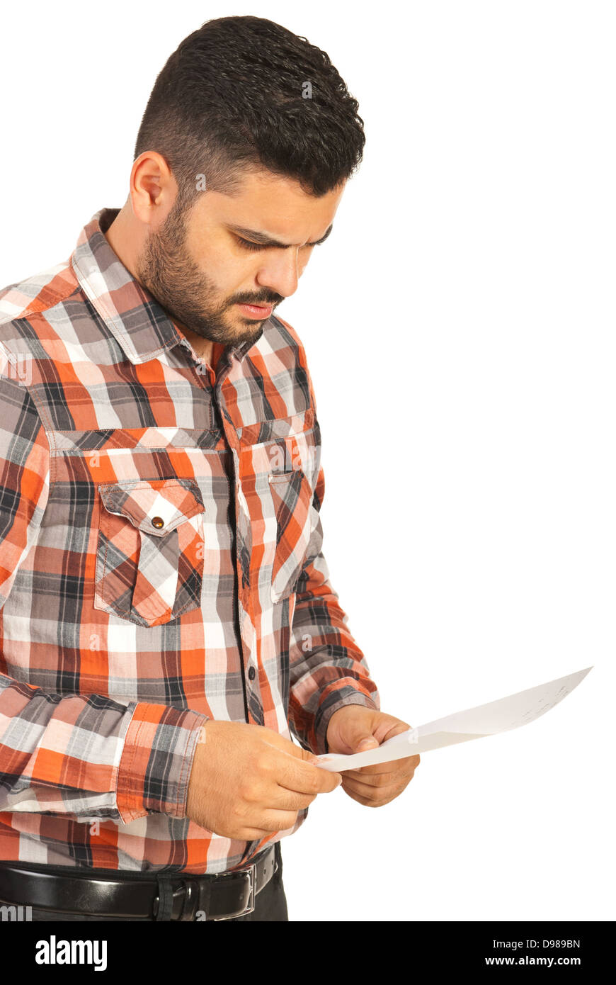 Confused man reading paper isolated on white background Stock Photo - Alamy