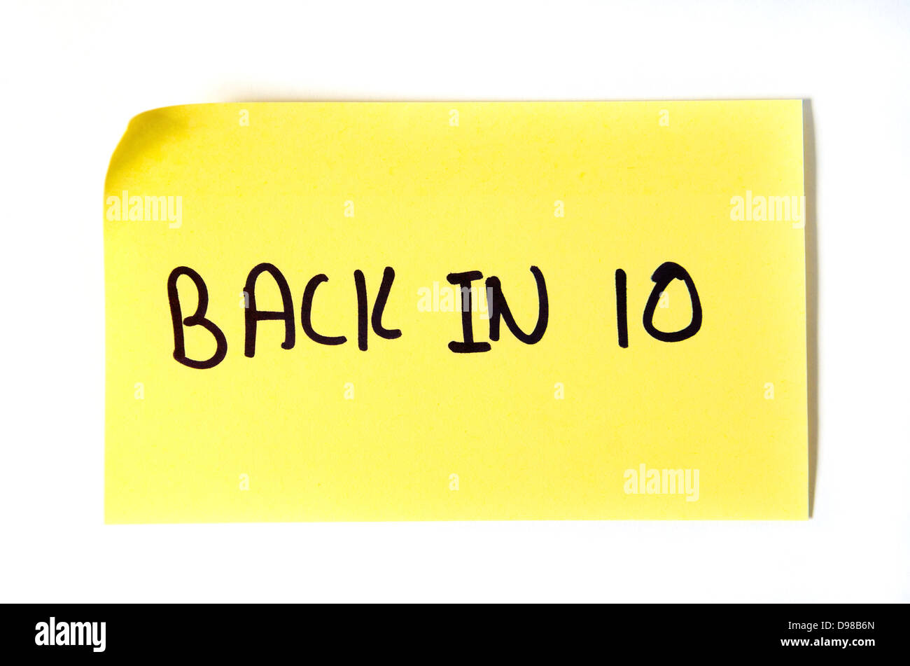 Back in 10 written on a yellow post-it note Stock Photo - Alamy