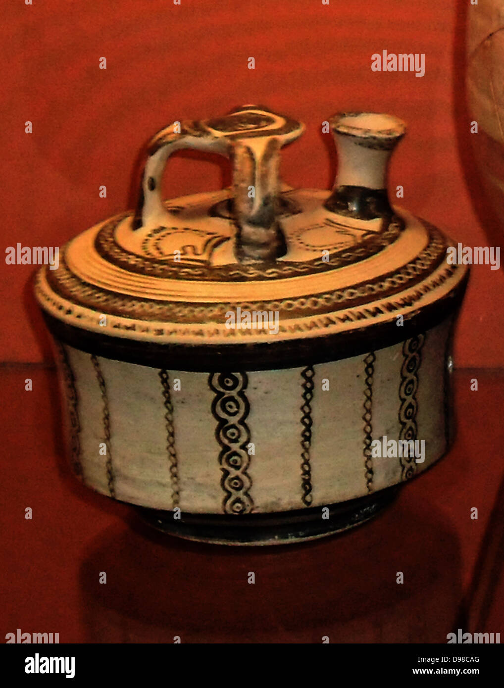Pottery three-handled jug decorated with a flower motif. Pottery krater ...