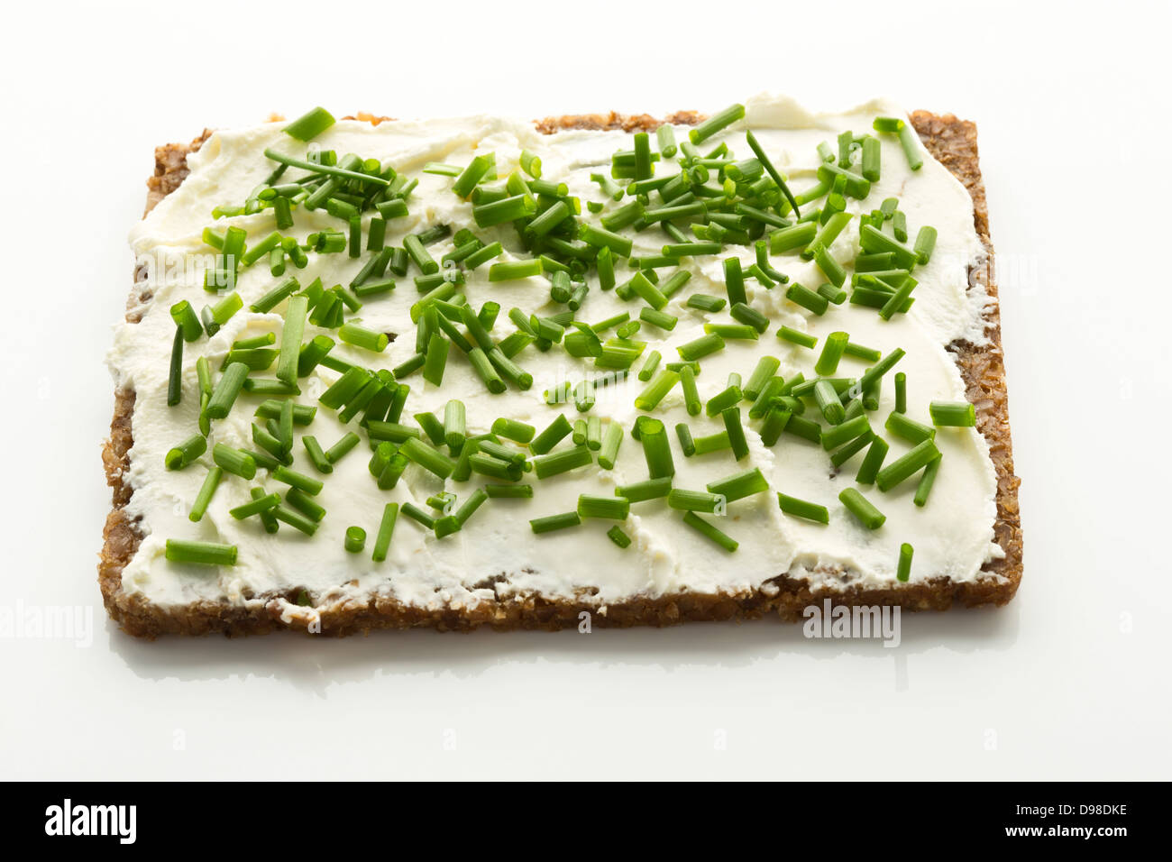 Cream cheese sandwich with chives on white background, close up Stock ...