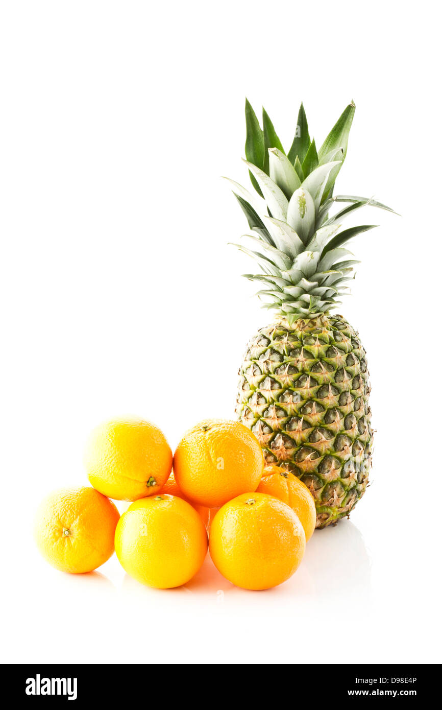 Oranges and pineapple on white background Stock Photo - Alamy