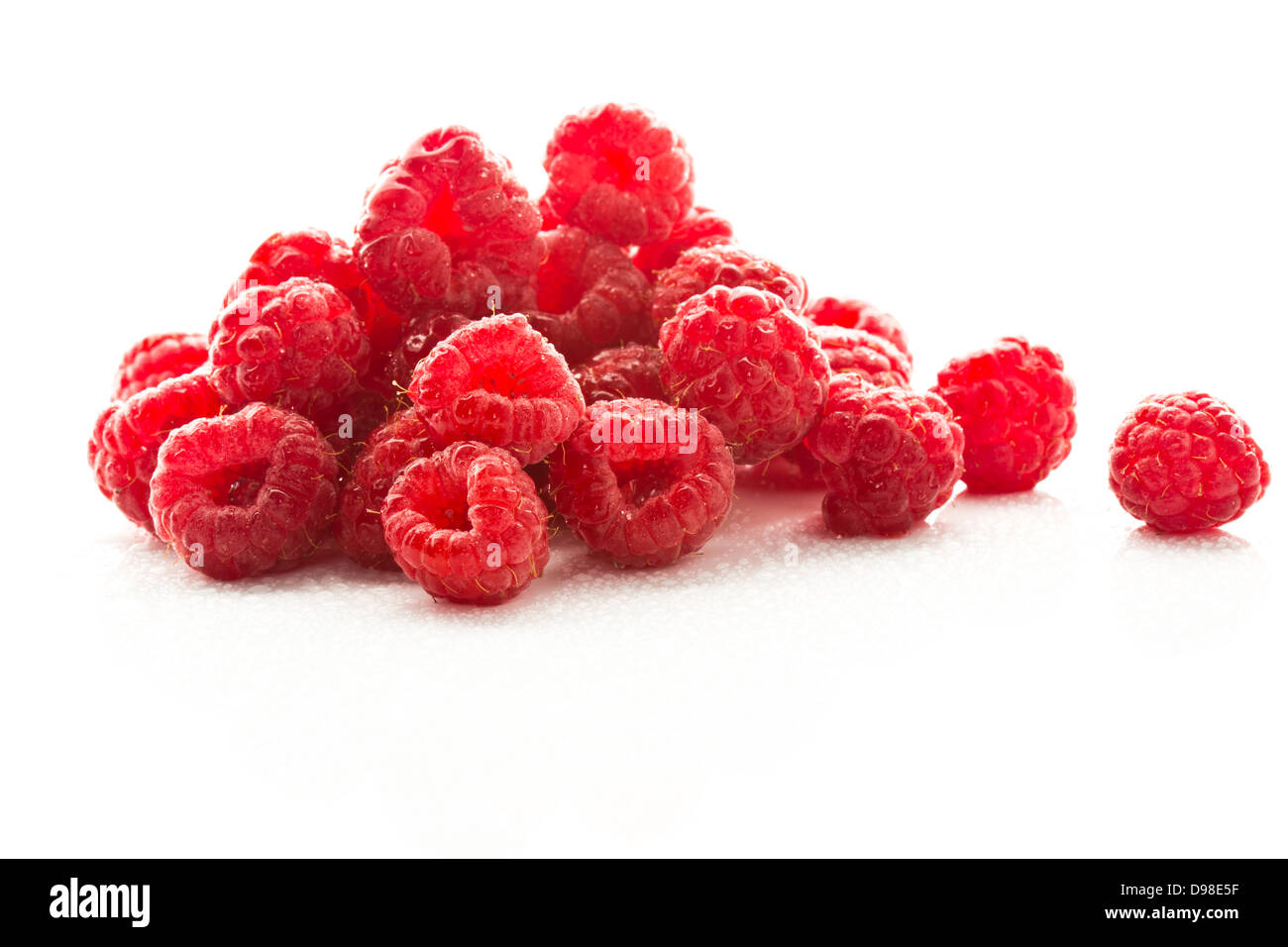 Raspberries on white background, close up Stock Photo - Alamy