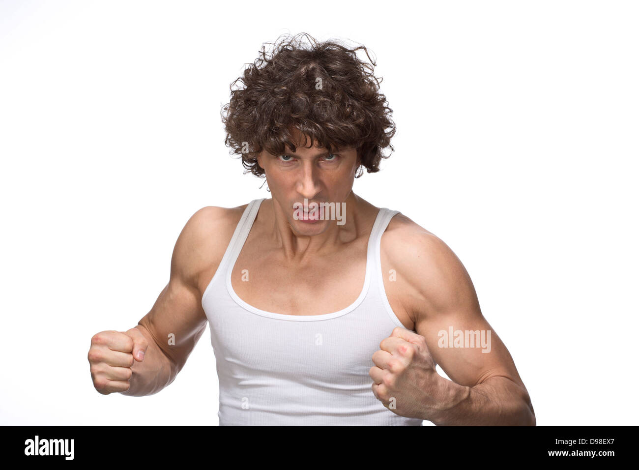 Mid adult man with angry face against white background Stock Photo - Alamy