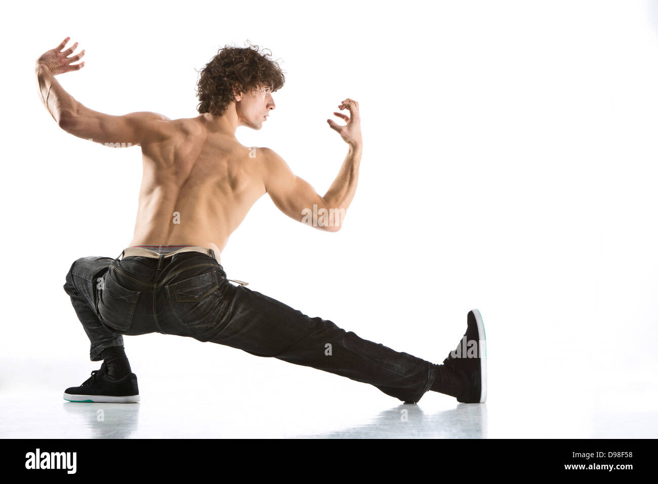 Crouching dance hi-res stock photography and images - Alamy