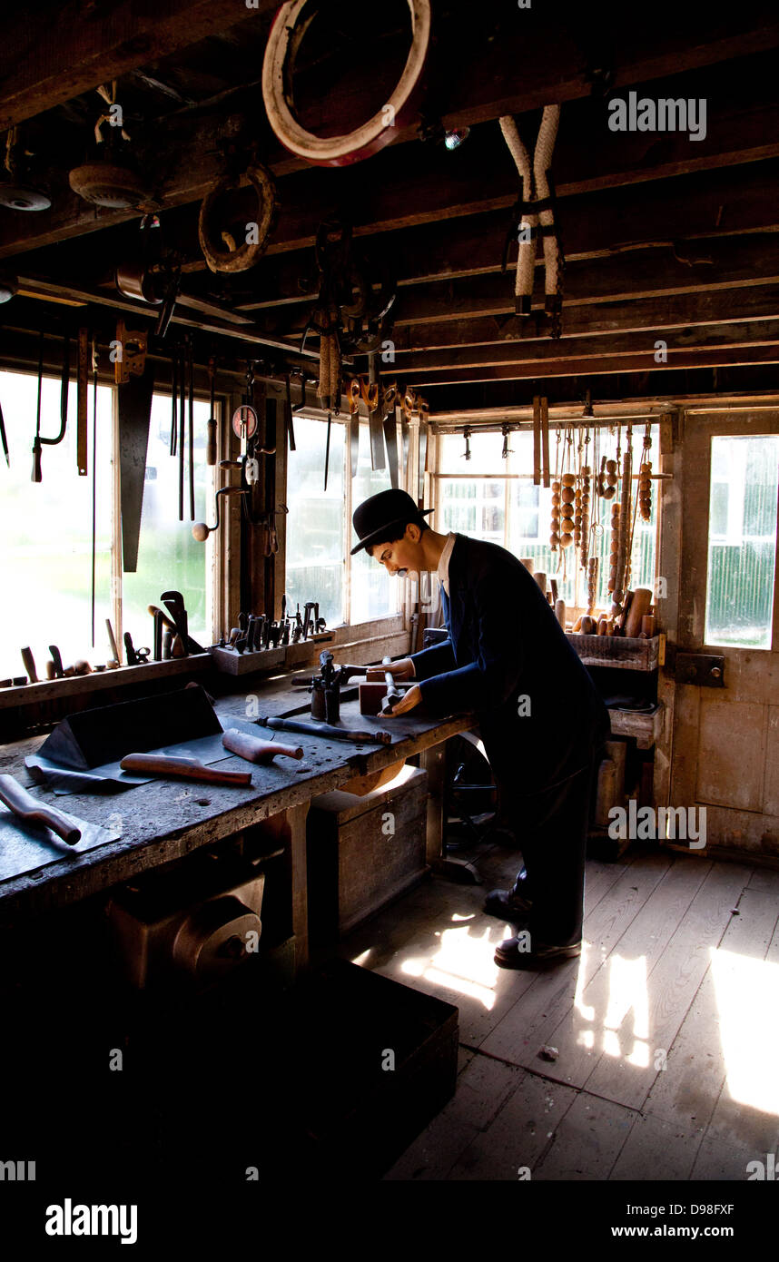 Interior of 19th century plumber's workshop with dummy at work Stock ...