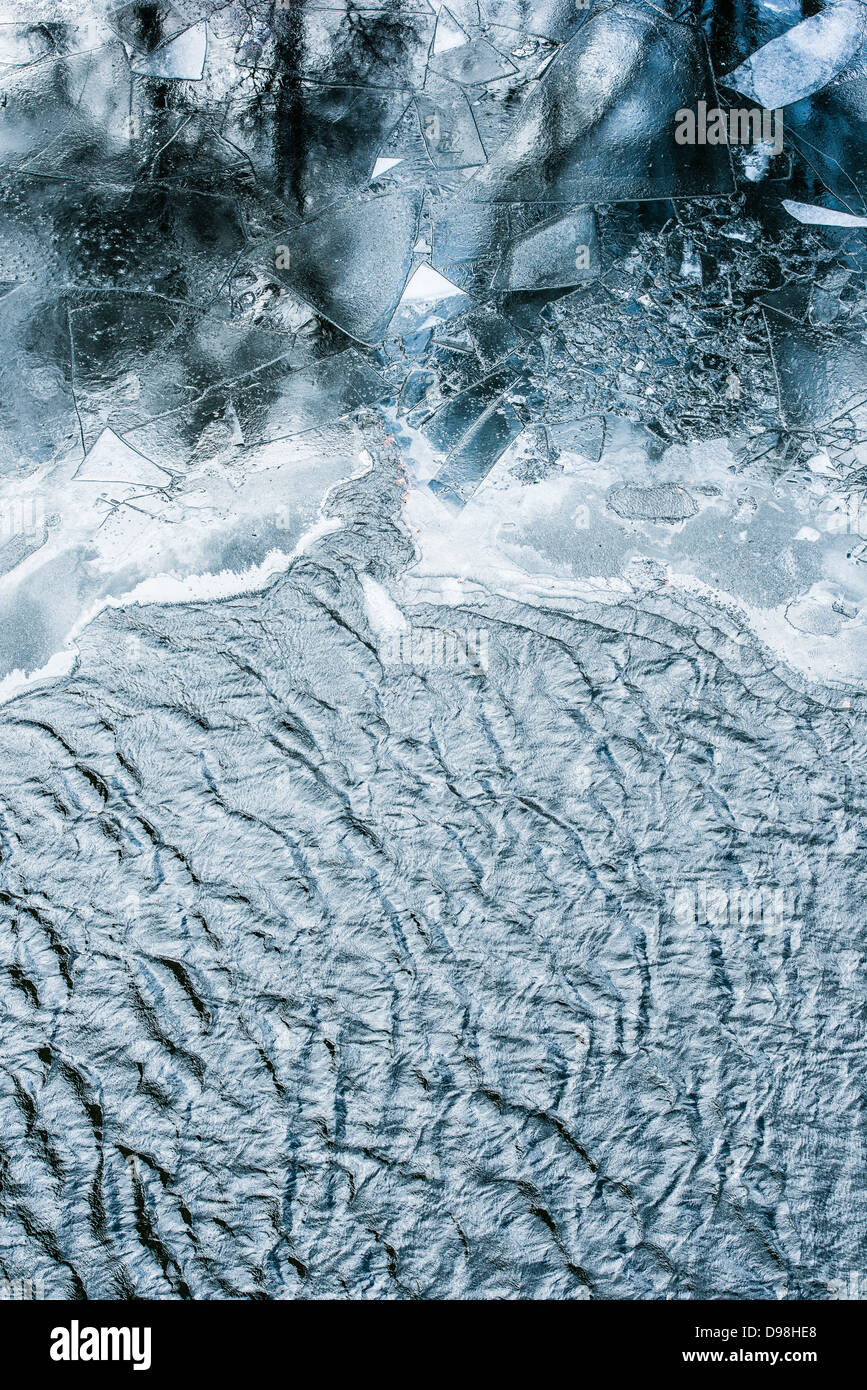 High angle view of water at spring with the ice partly melted ...