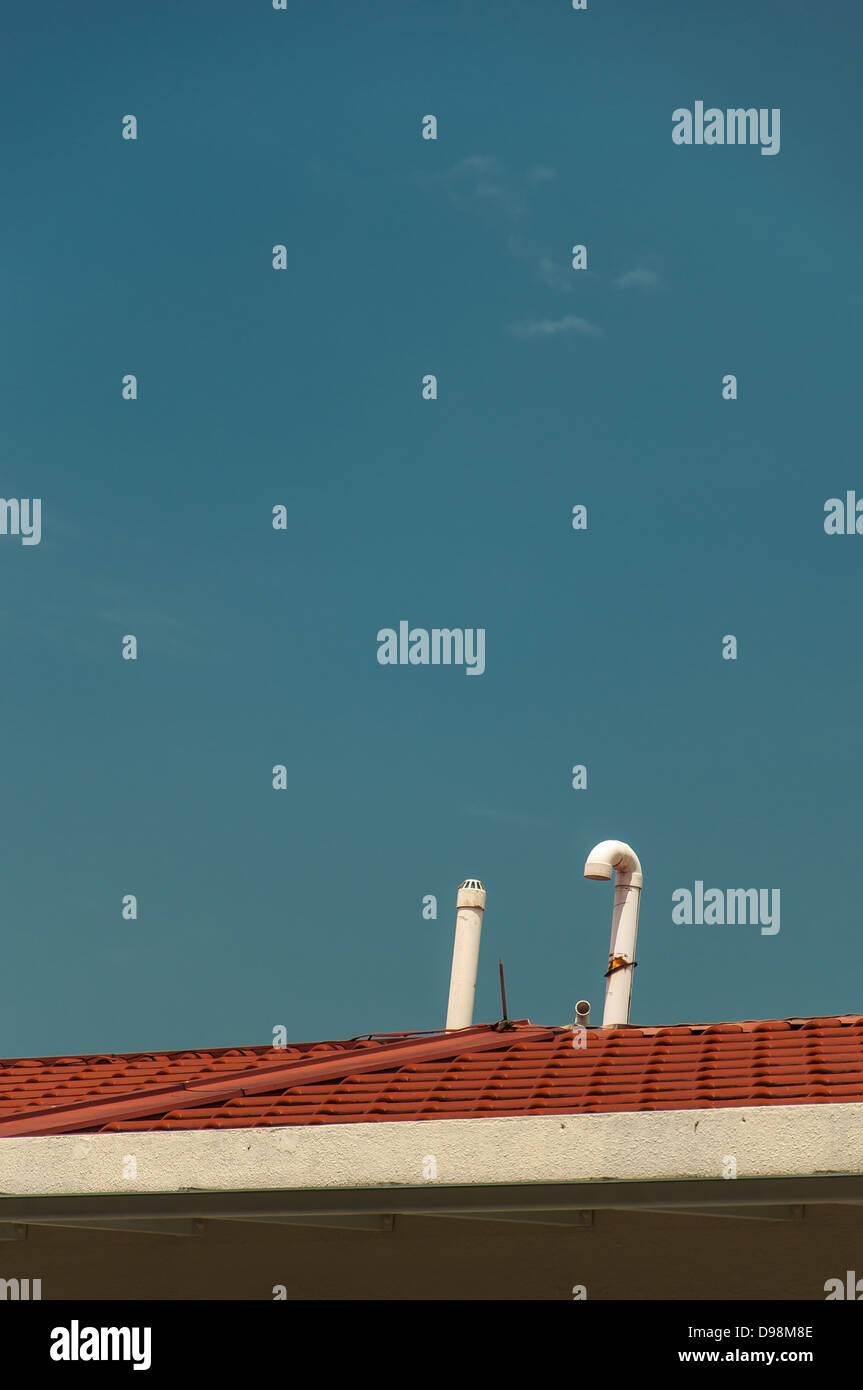 Exhaust pipe and ventilation on top of the house Stock Photo - Alamy