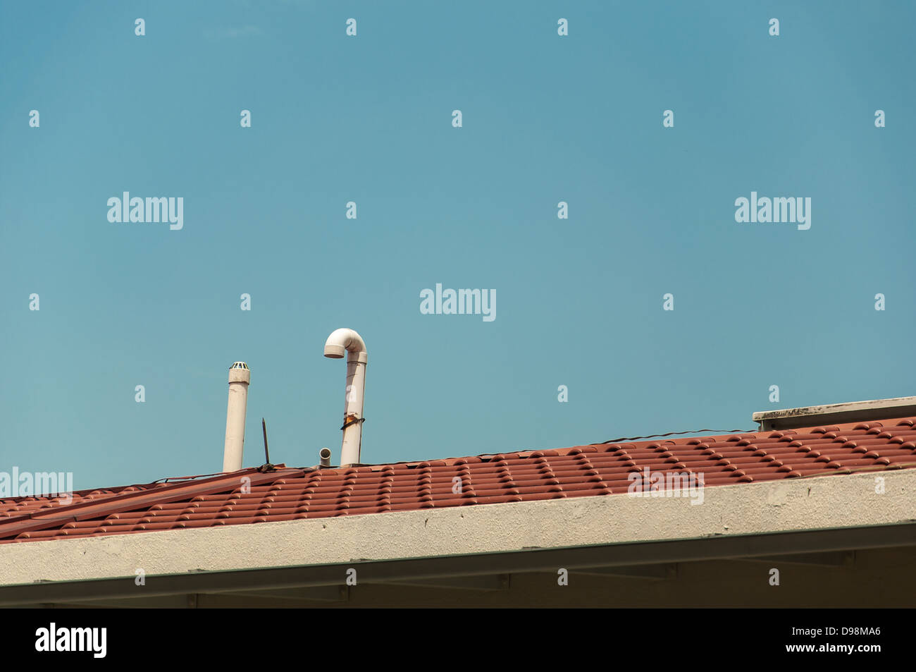 Exhaust pipe and ventilation on top of the house Stock Photo - Alamy