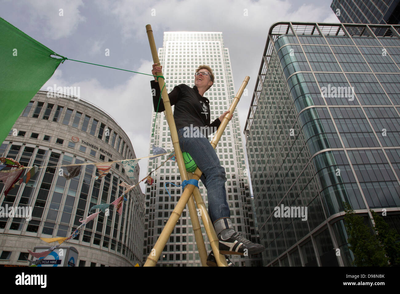 Anti G8 demonstrators on tripods in the Canary Wharf business district ...