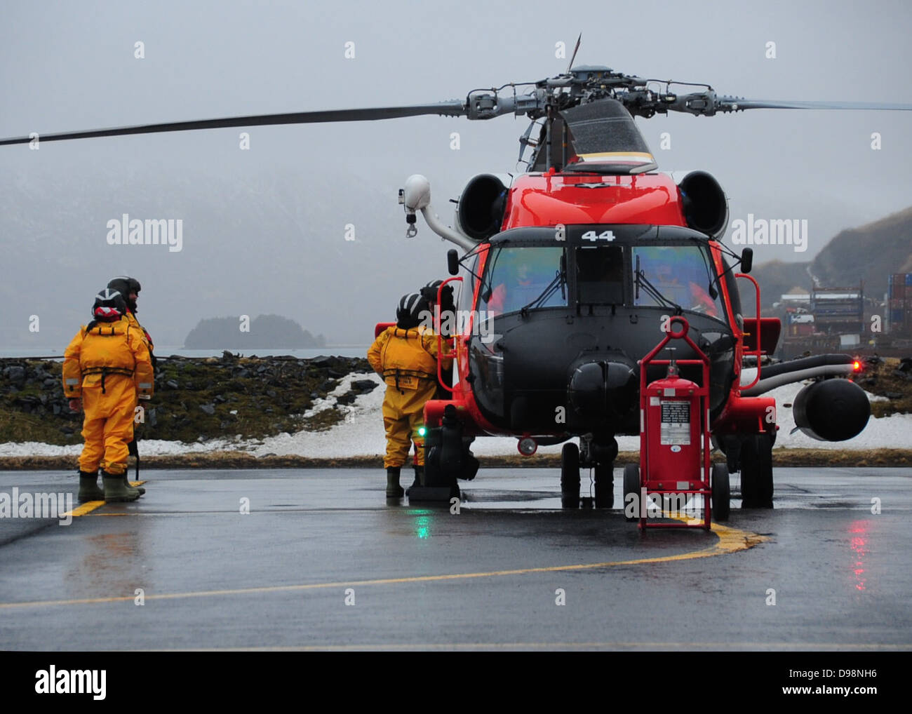 Salvage technicians board an MH-60 Jayhawk helicopter at Air Station ...