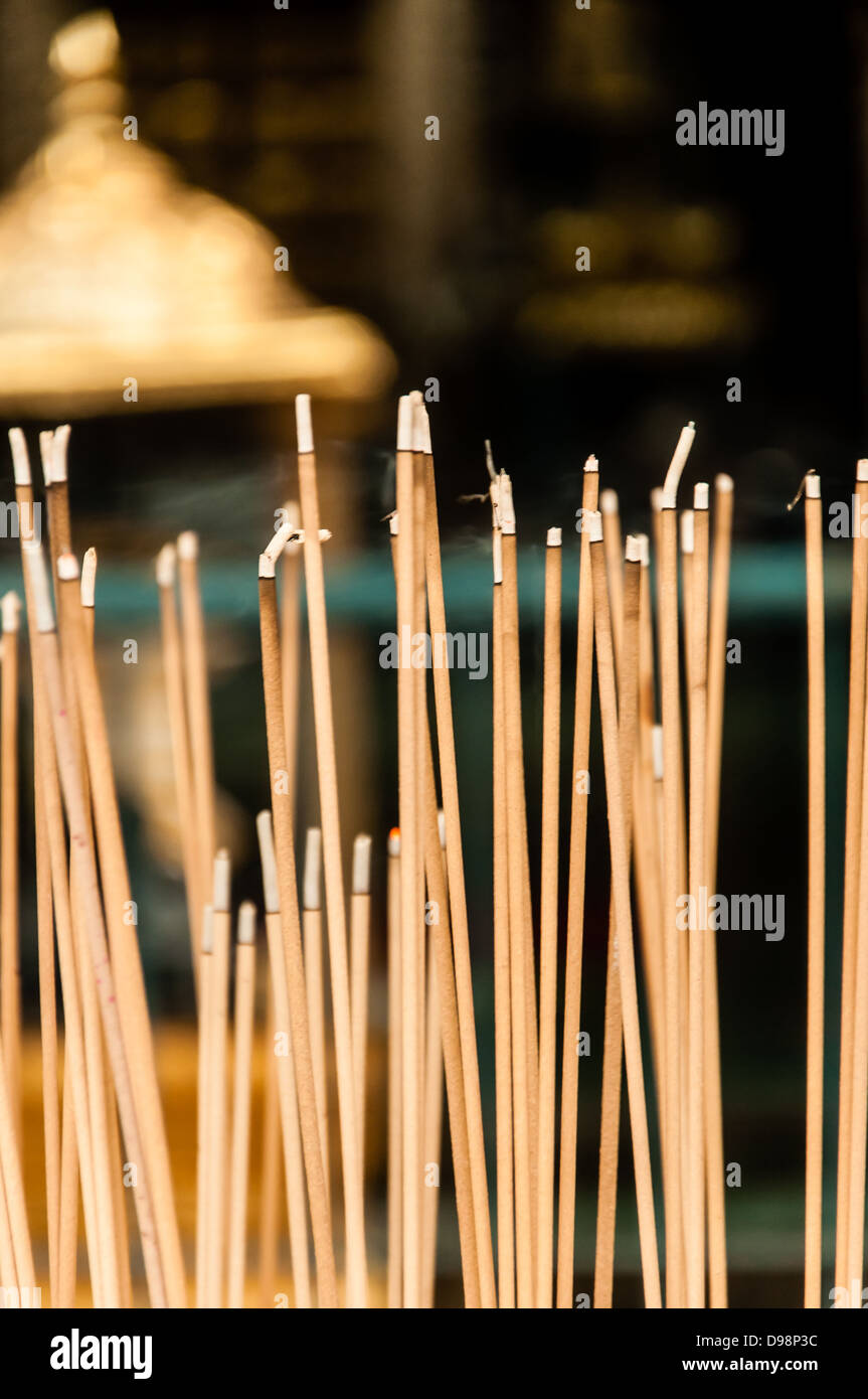 Burning essence sticks outside temple Stock Photo - Alamy