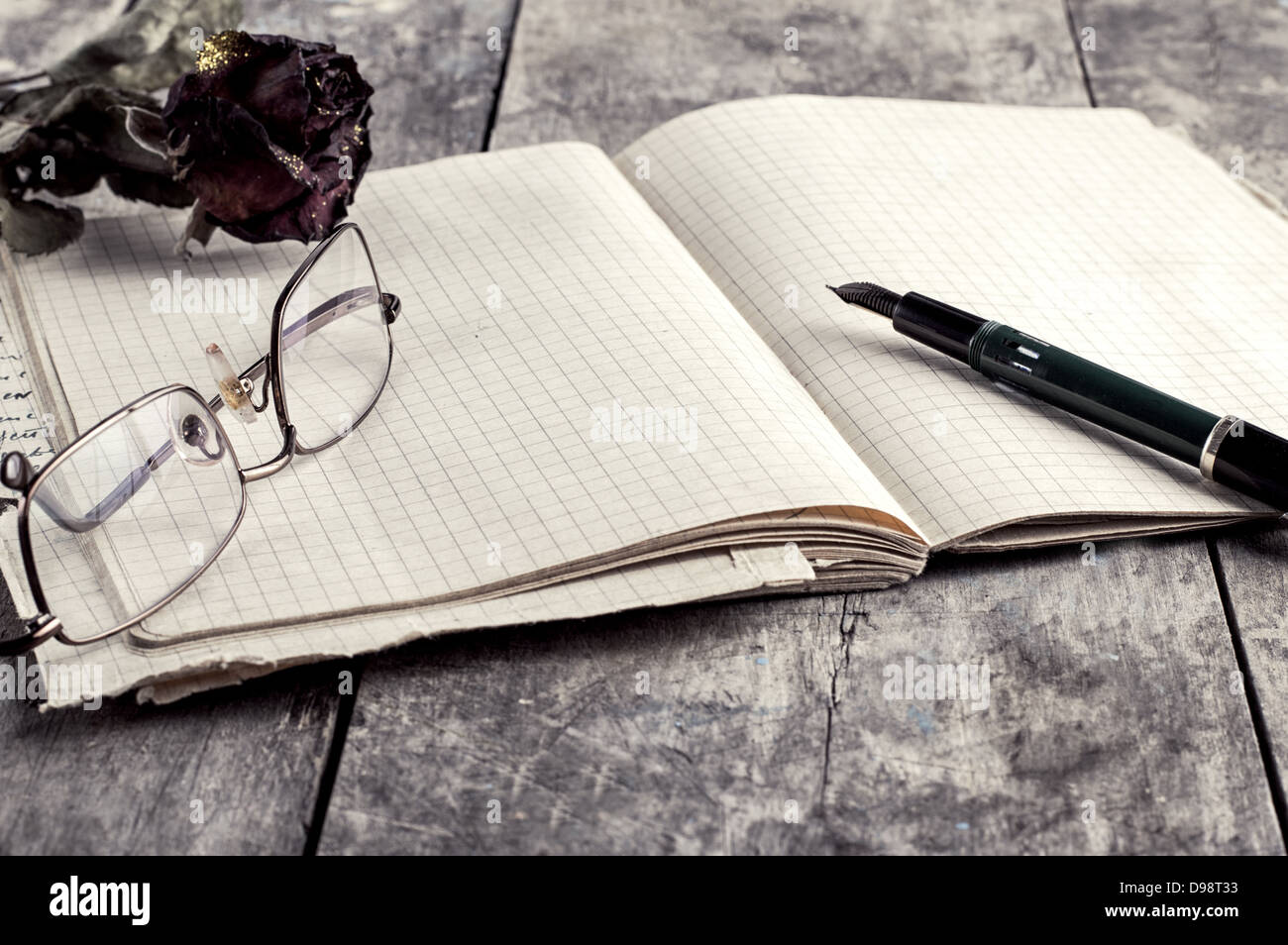 dried rose on old notebook,love letter Stock Photo - Alamy