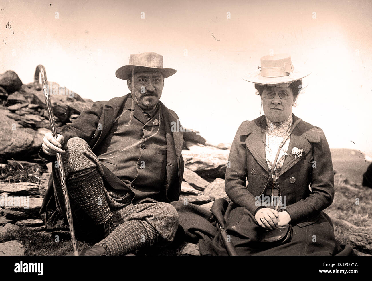 French man and woman sitting on a hillside circa 1900 Stock Photo - Alamy