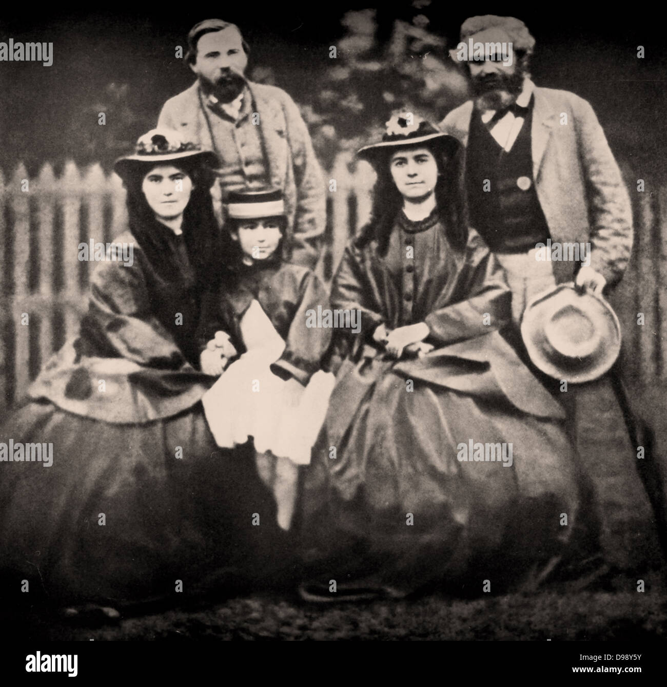 Karl Marx with his daughters Jenny, Lara and Eleanor standing behind ...