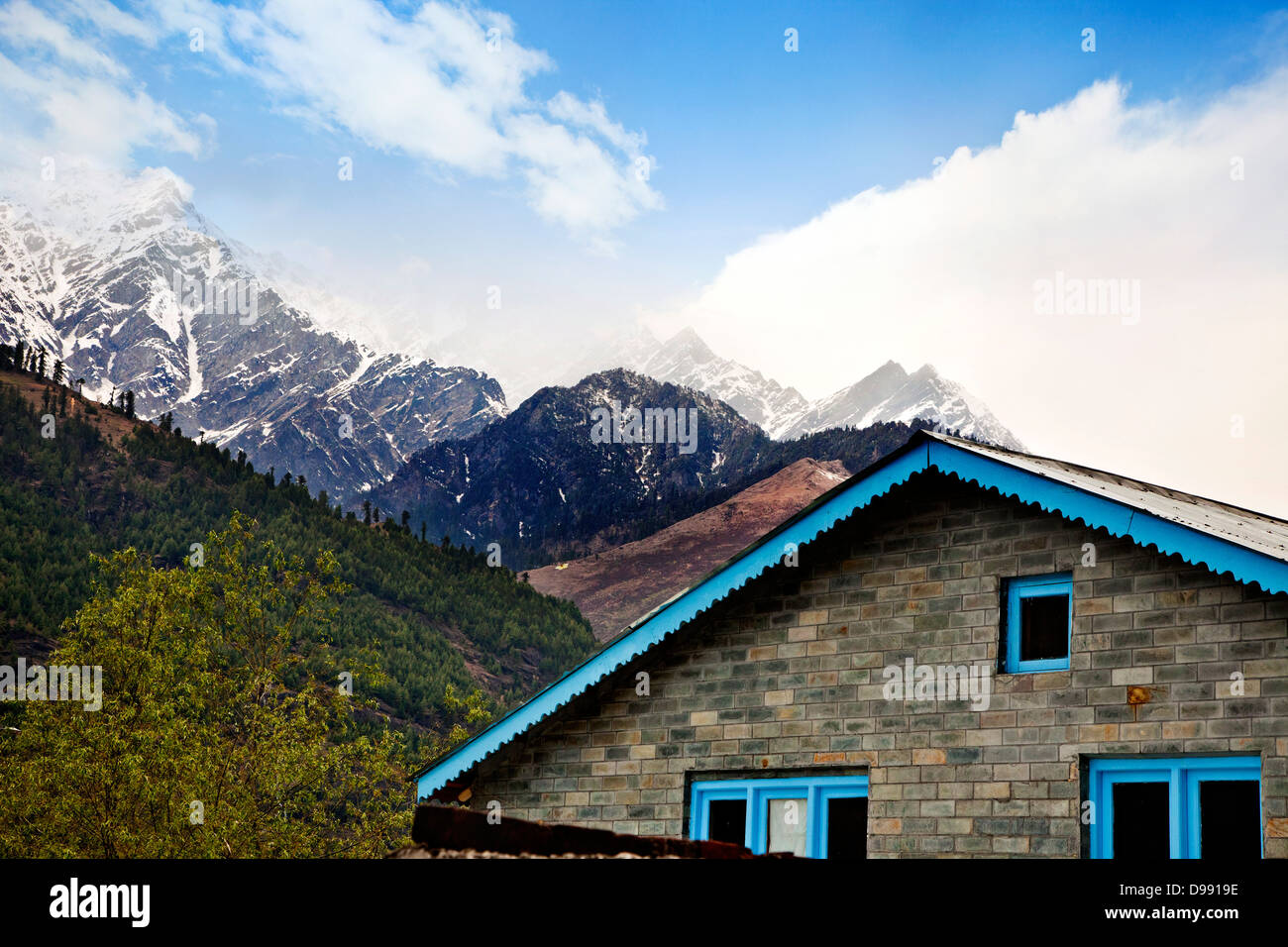 House with mountain range in the background, Manali, Himachal Pradesh ...