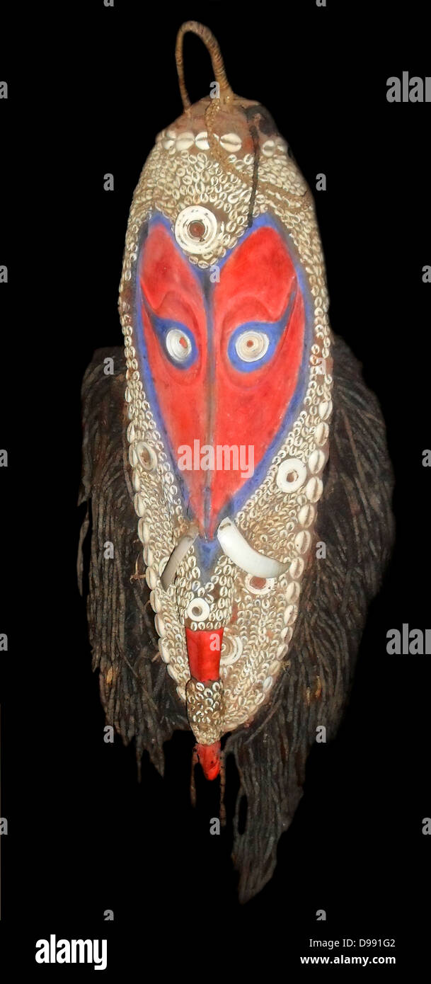 Mask in wood boar tusks and shells. Timbunke, Papua New Guinea, 1959 ...