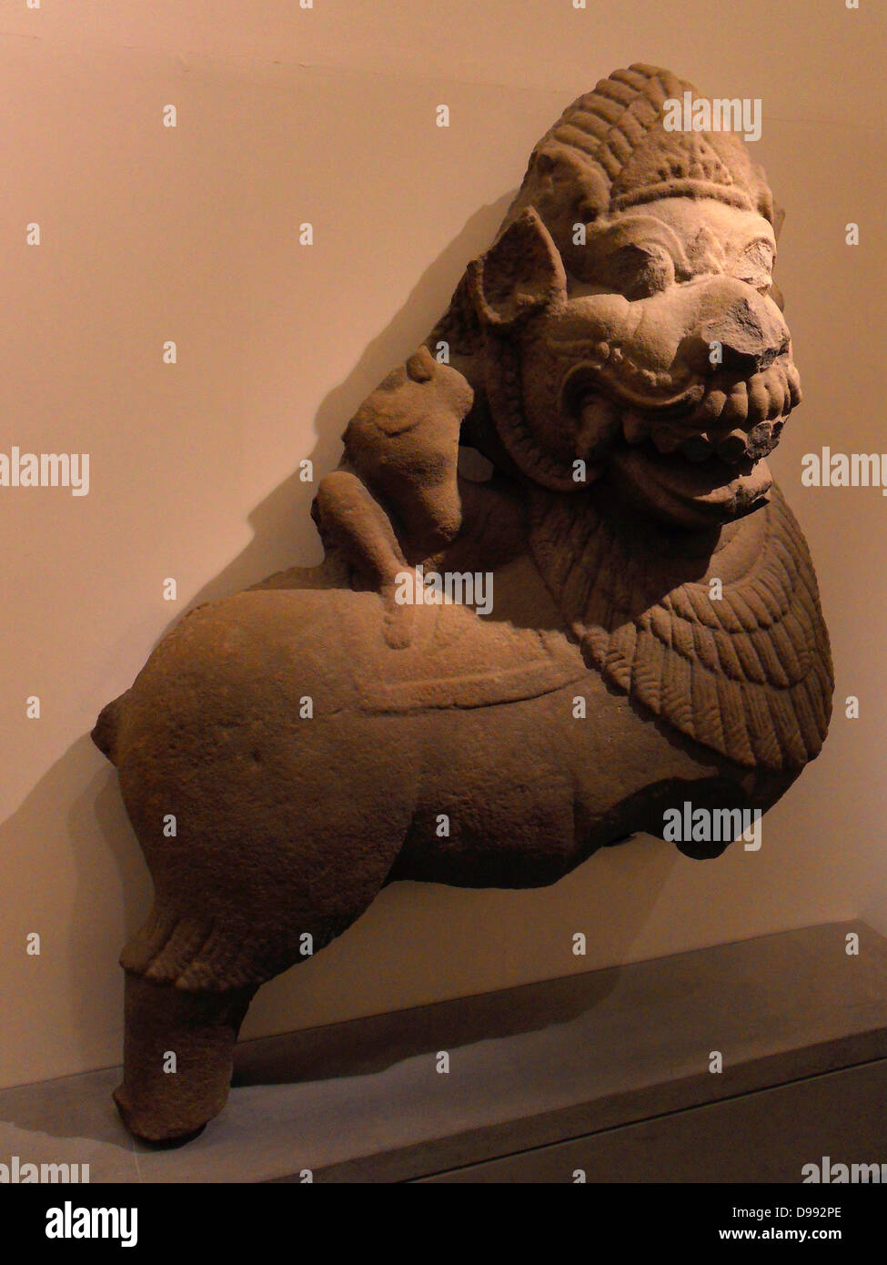 Basement decor. lion passant overlapped by a small person. Tra Kieu ...