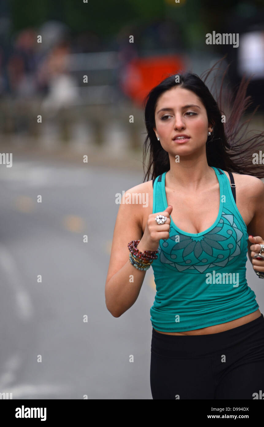 Attractive young mixed race woman running in Central Park, New York ...