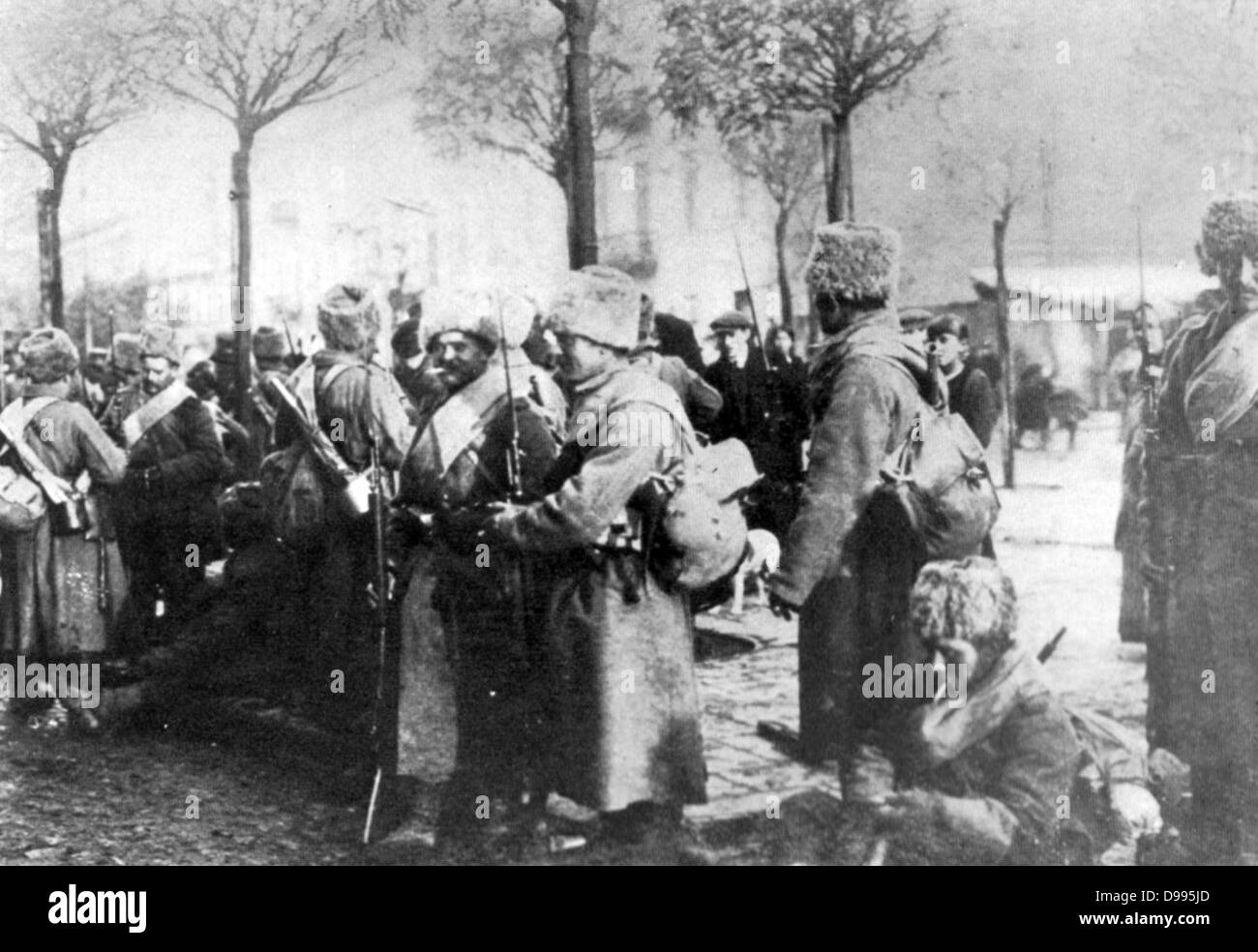 Siberian infantry in fur hats and coats and carrying field kit, resting ...