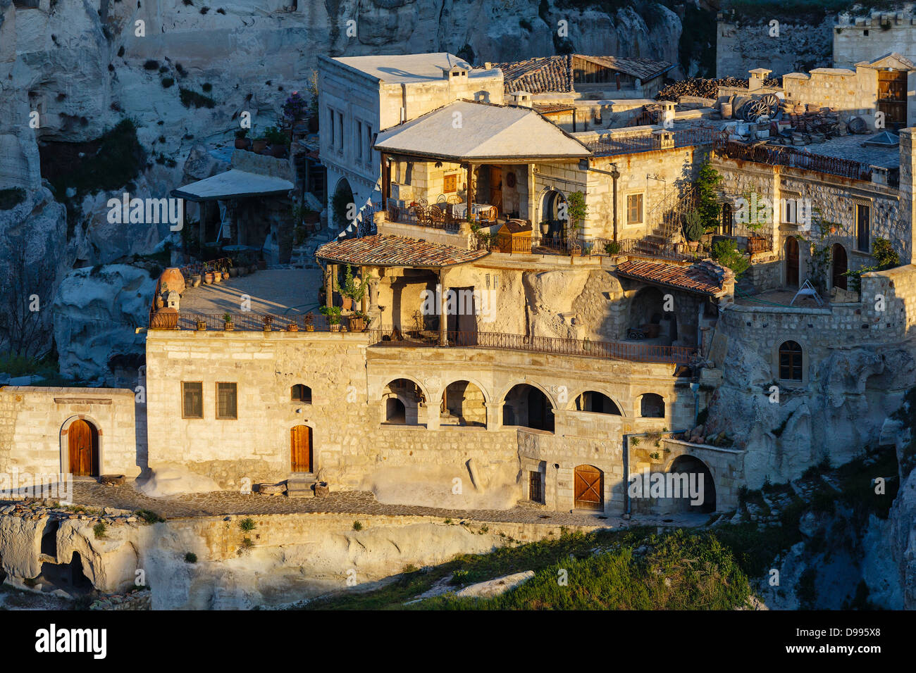 Building attached to the rock in rising sun beams Stock Photo - Alamy