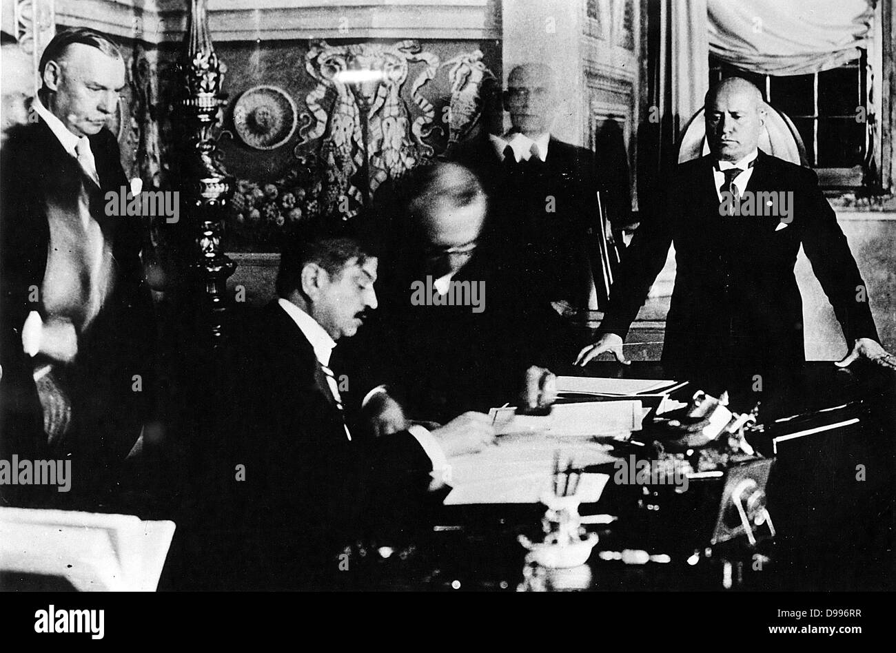 Benito Mussolini and French Prime Minister Pierre Laval sign French ...