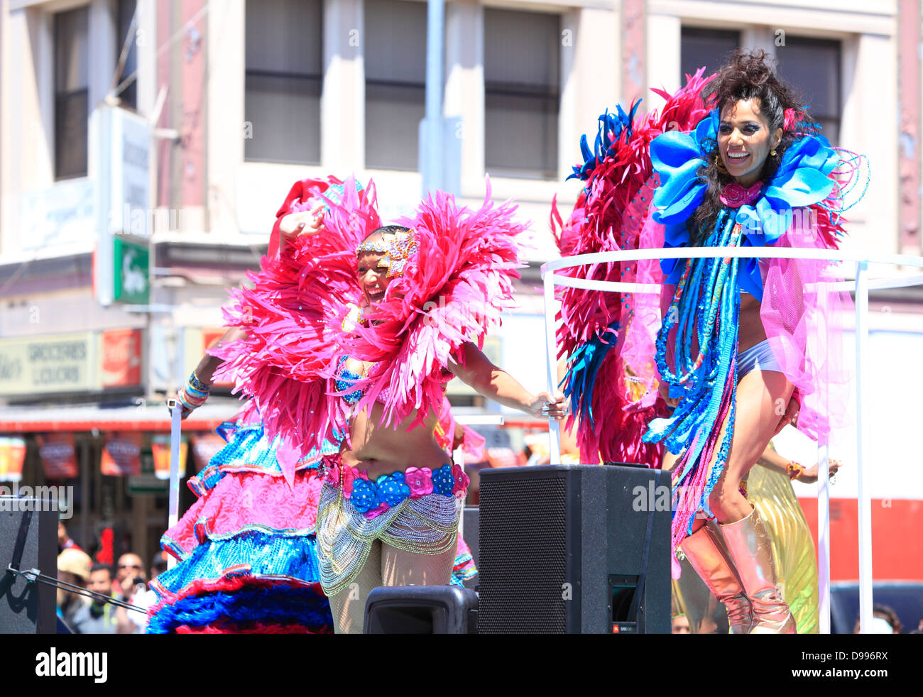 Colorful and spirited dancers on a float during carnaval parade in ...