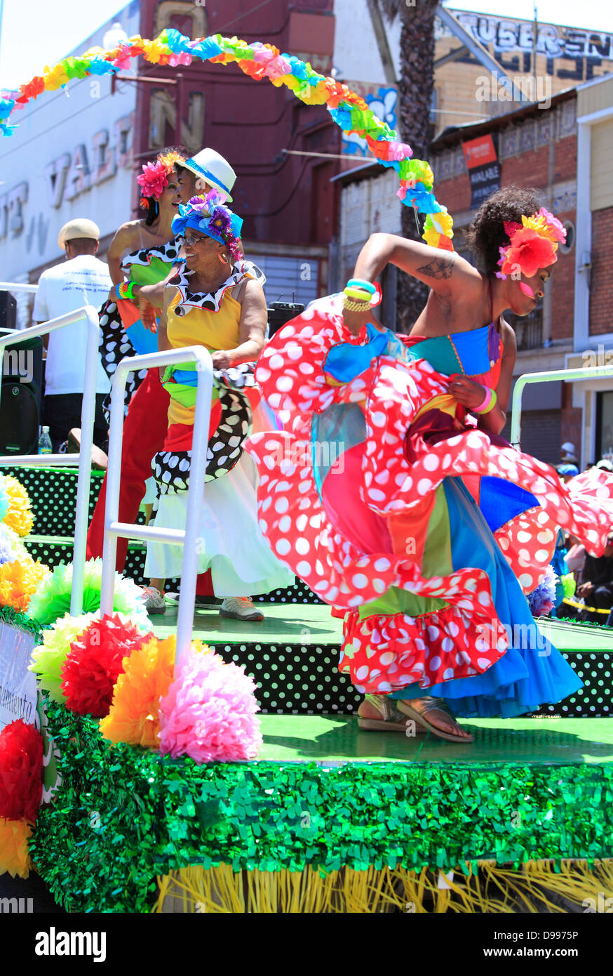 Colorful and spirited dancers on a float during carnaval parade in ...