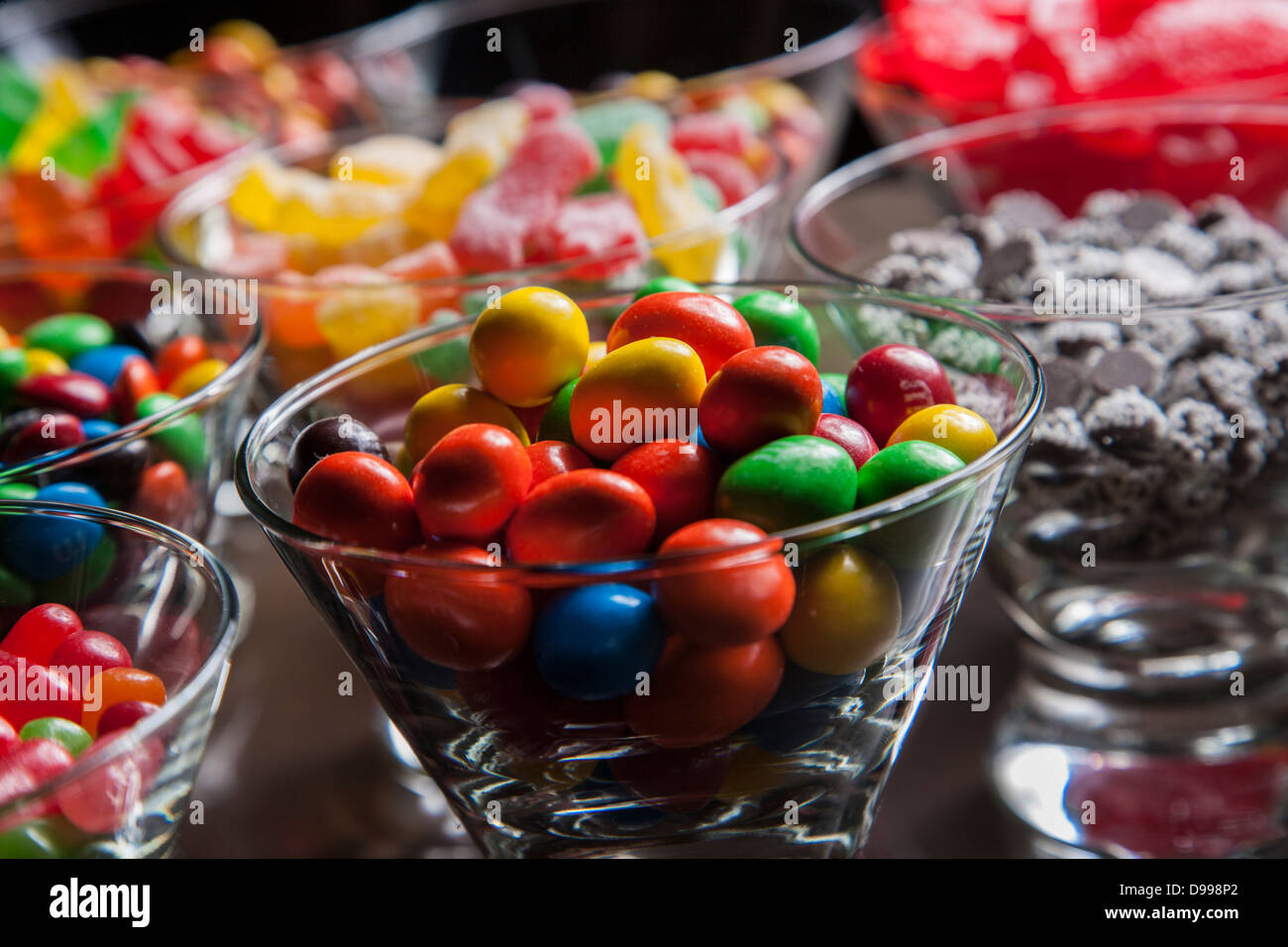 colorful mixed candies in small clear glass bowls Stock Photo - Alamy