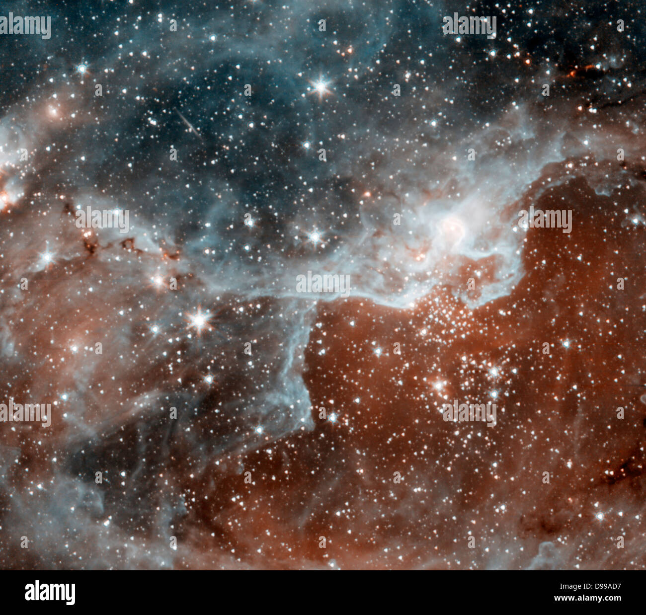 The image shows a cloud, known as DR22, bursting with new stars in the ...
