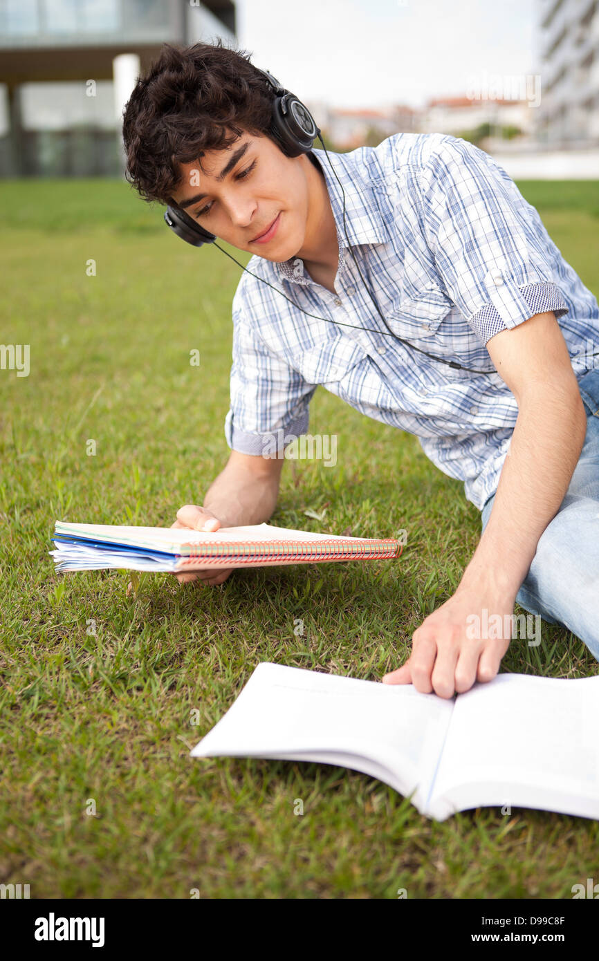 Young boy studying at the park Stock Photo - Alamy