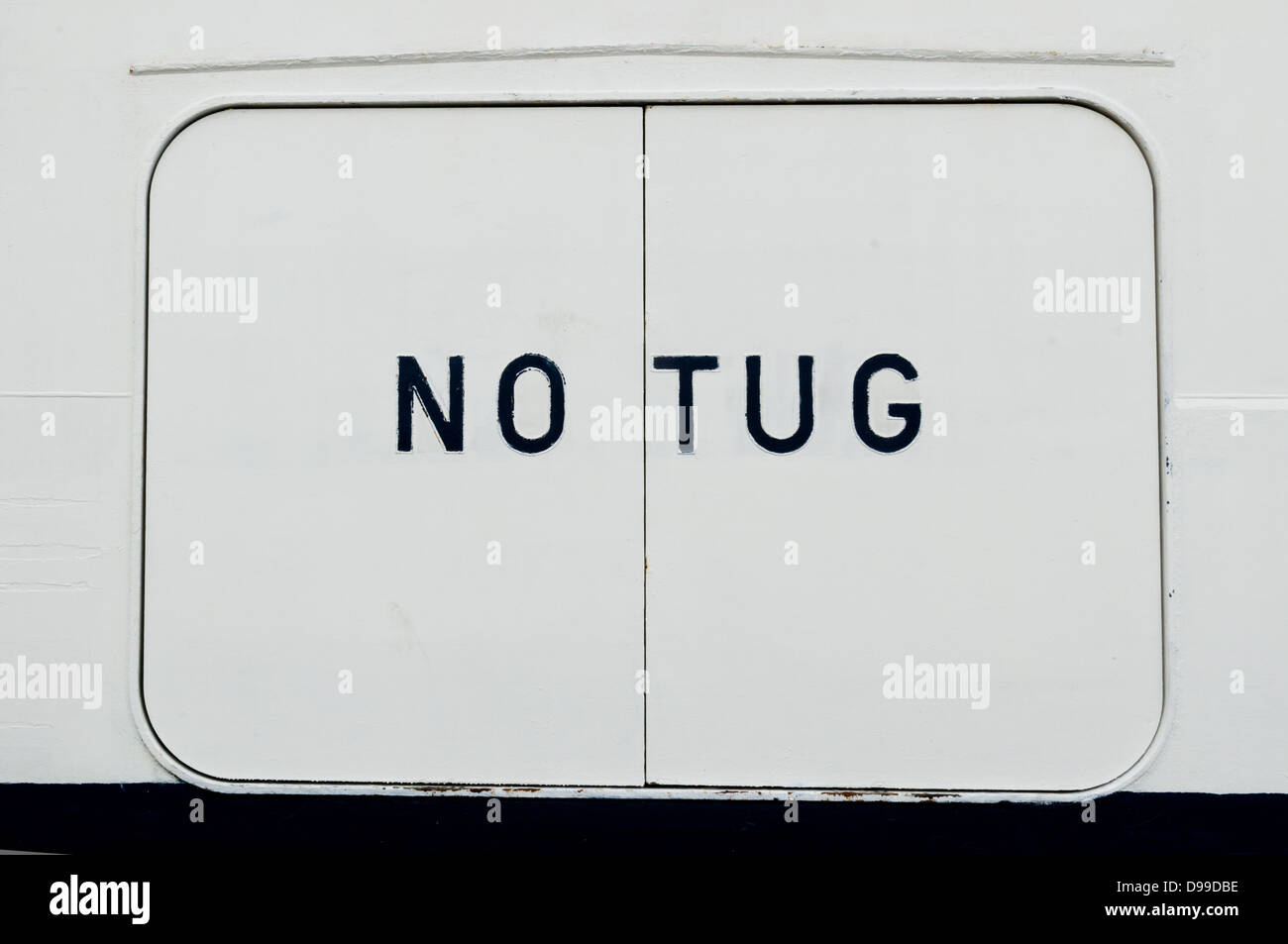 A sign on the ships side warns away tugs Stock Photo - Alamy