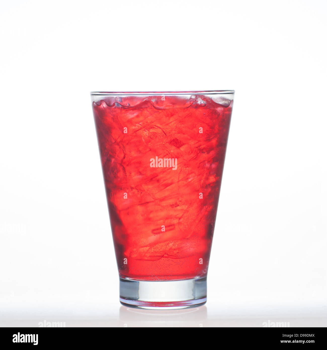 Sparkling red color drinks with water soda and ice in glass isolated on ...