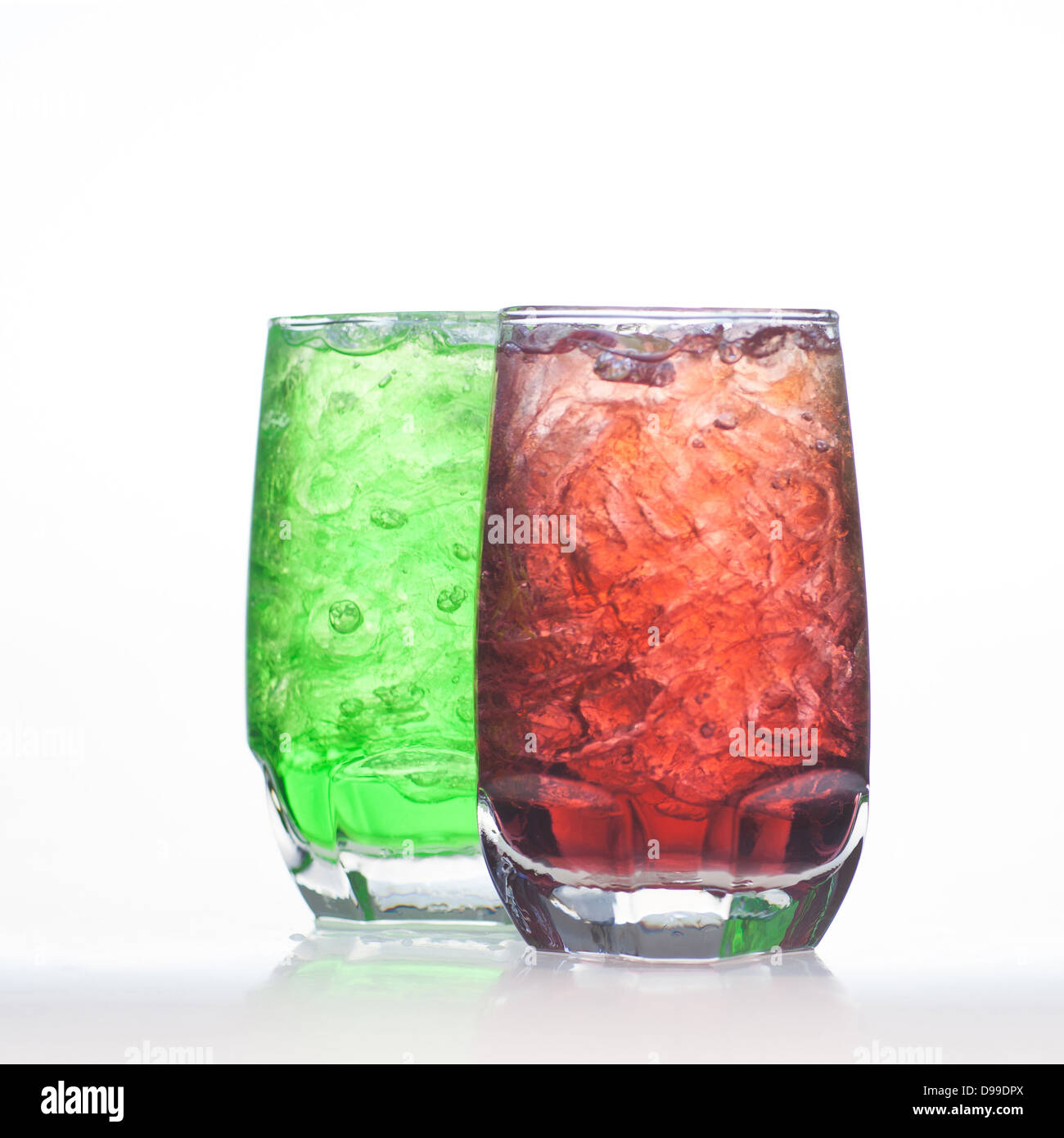 Green and root beer flavor aerated soft drinks whit water soda and ice ...