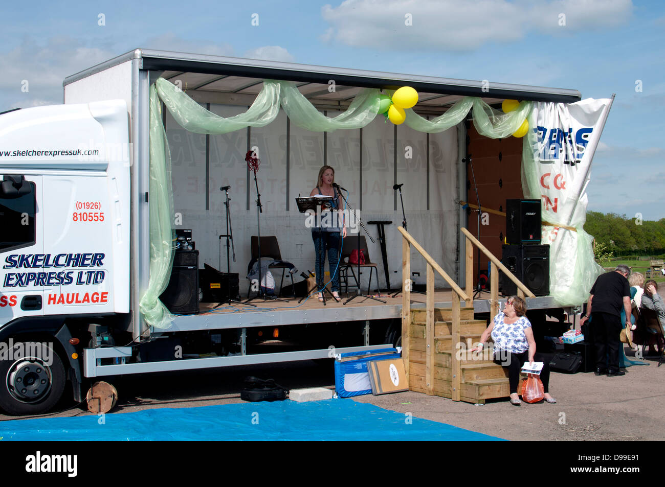 Village fete singer on lorry Stock Photo - Alamy