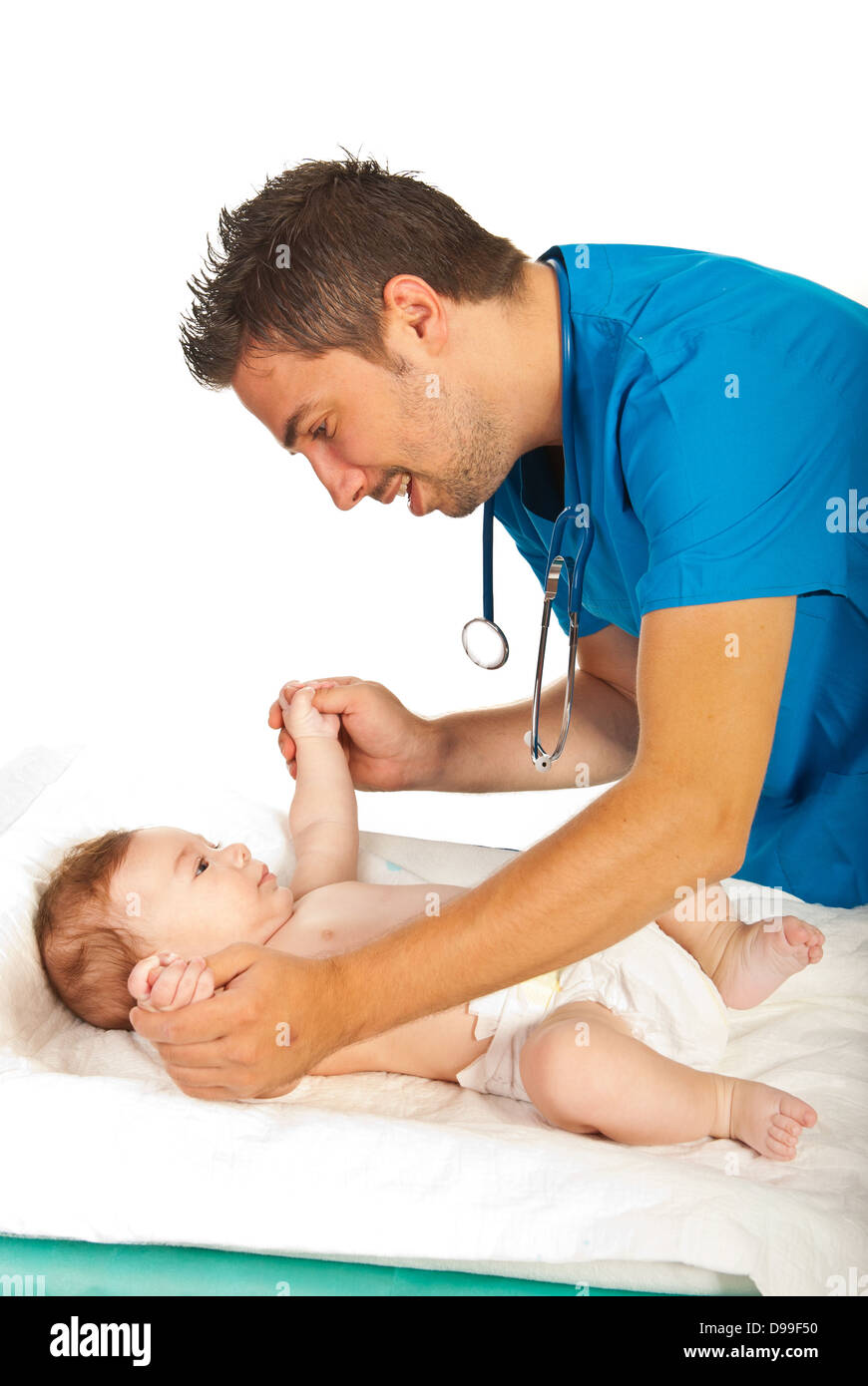 Doctor checking locomotor skills reflex hands to a baby boy in his ...