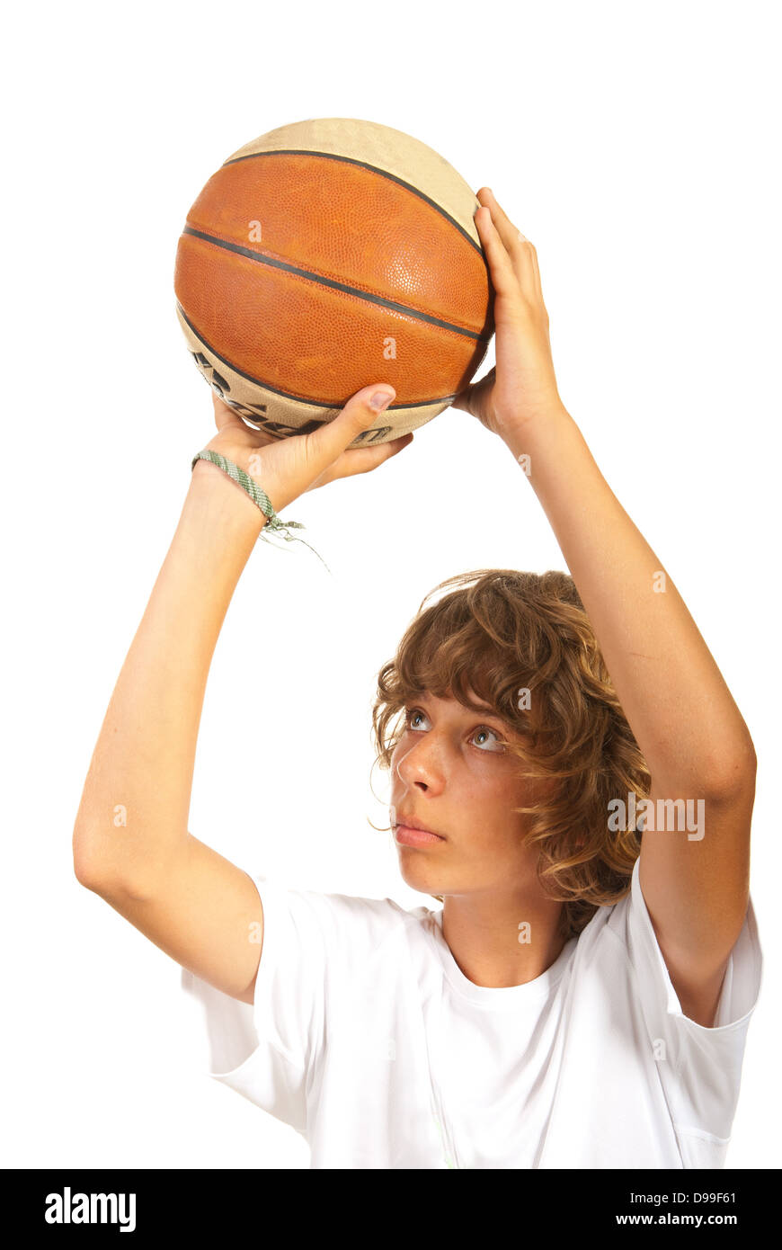 Close up of child throwing basketball isolated on white background ...