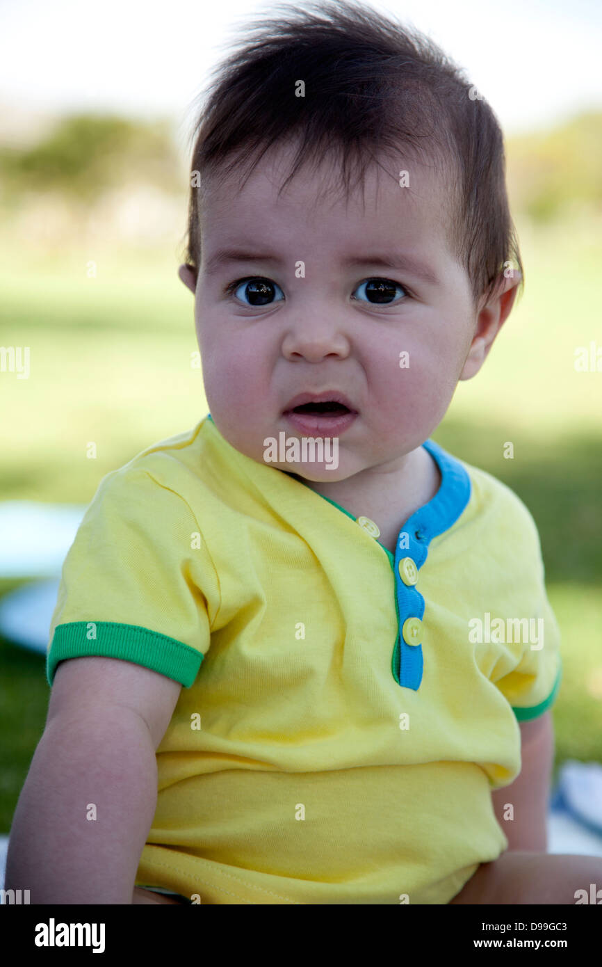 Baby Boy in yellow Outdoors Stock Photo - Alamy