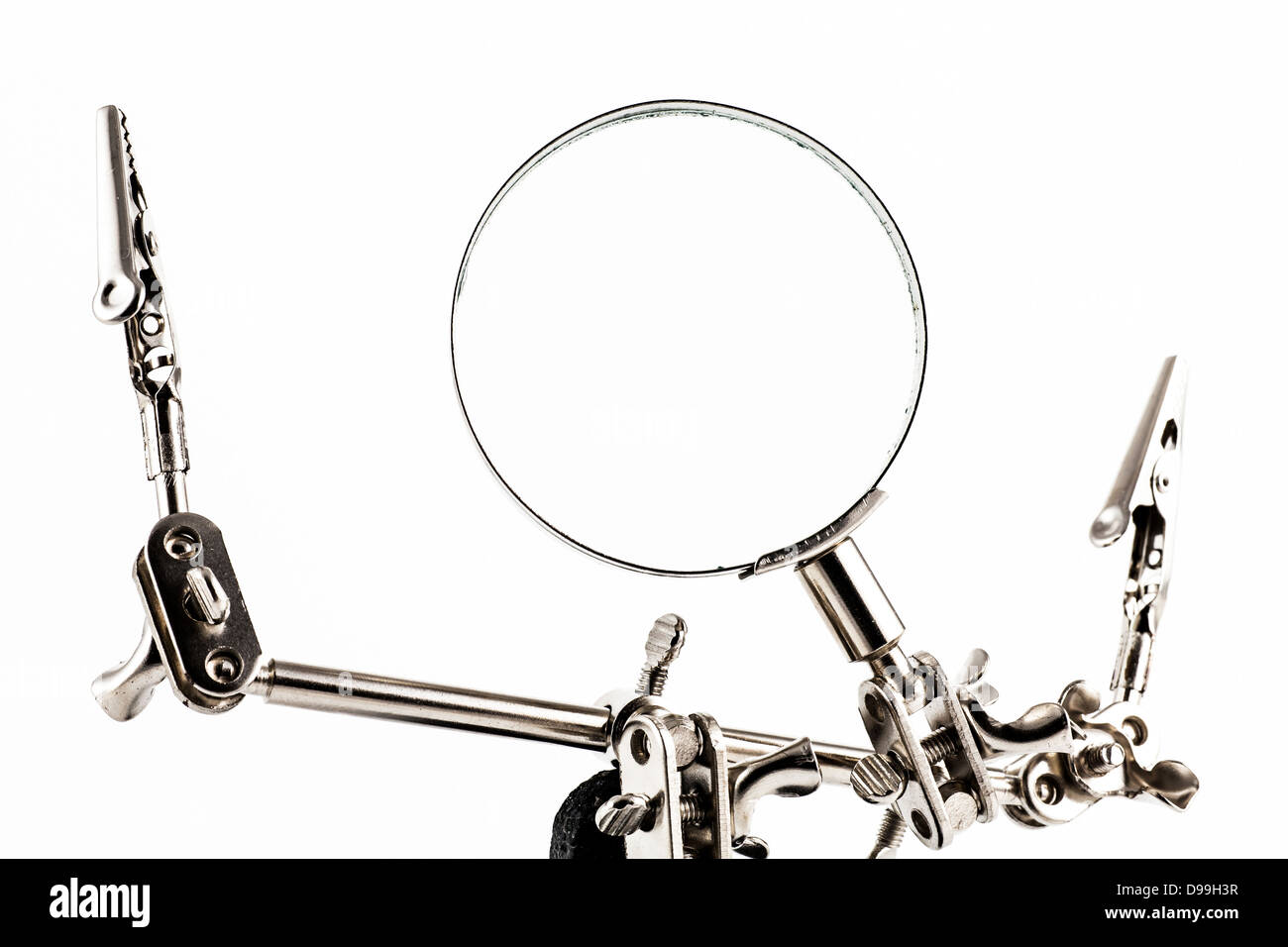 Magnifier with three handles used for watch repairs Stock Photo - Alamy