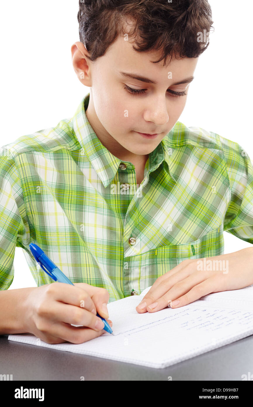 Caucasian student boy at his desk writing for homework Stock Photo - Alamy