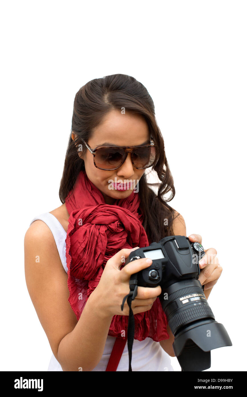 Female photographer holding a camera Stock Photo - Alamy