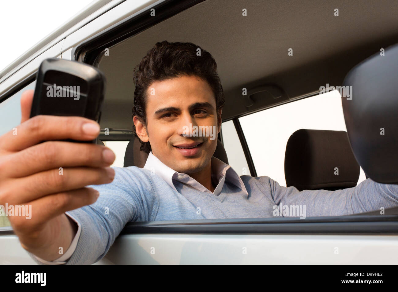 Indian man driving car hi-res stock photography and images - Alamy
